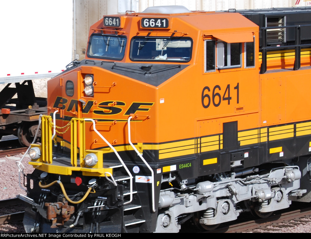 BNSF 6641 close up of her Brand New Swoosh logo on the front and her Road Numbers on the side.